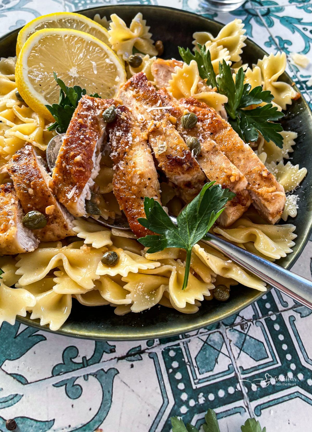 BEST Chicken Piccata Recipe - Buttery, lemon caper chicken over pasta