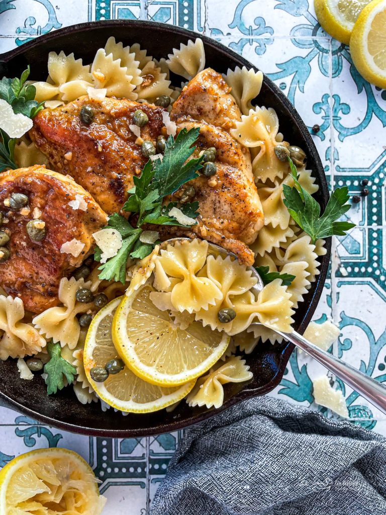 BEST Chicken Piccata Recipe - Buttery, lemon caper chicken over pasta