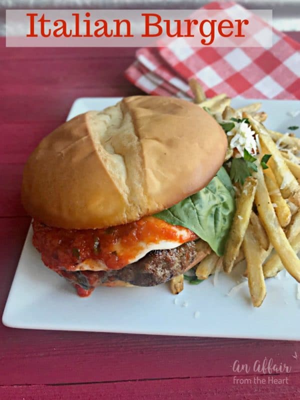 Italian Burger with fresh basil and mozzarella on a garlic bread bun.