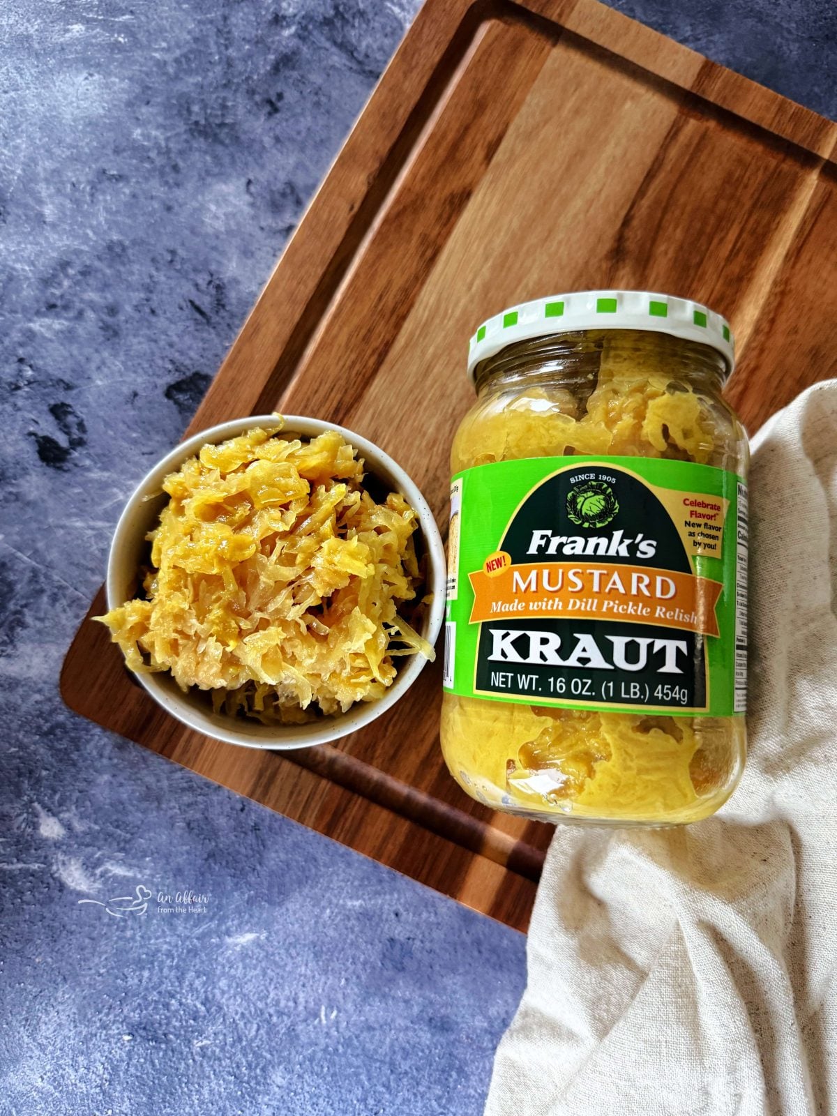 Bratwurst Sliders with Mustard Kraut on Pretzel Buns